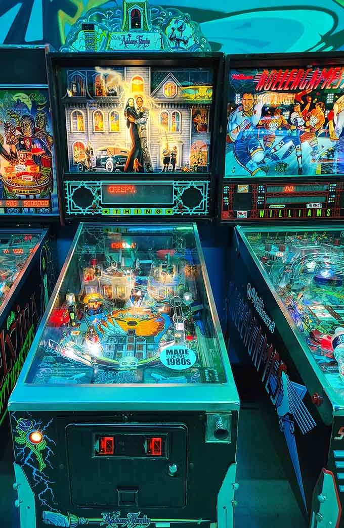 Pinball machines standing proud, ready to drain your ball faster than you can say "tilt."