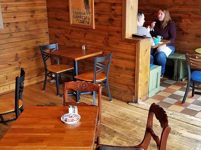 The wood paneling and checkered floors create that perfect neighborhood vibe where everybody eventually becomes a regular patron.