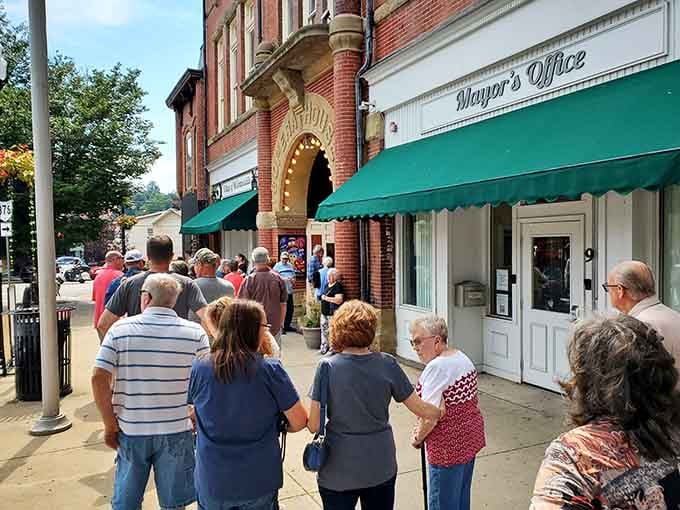 Crowds gather at the entrance, drawn by the promise of entertainment that transcends any streaming service.