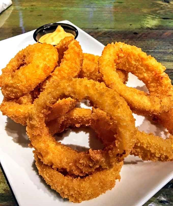 Onion rings with a golden crust that could make you forget you're supposed to be exercising by throwing balls.