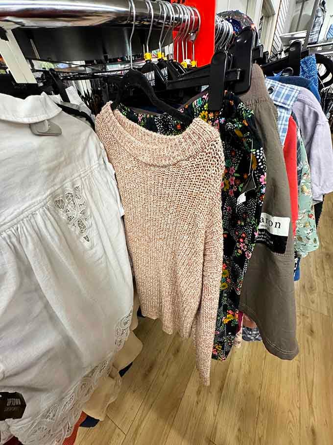 Sweaters organized by color like a fashion rainbow, making it impossible to claim you can't find anything good here.