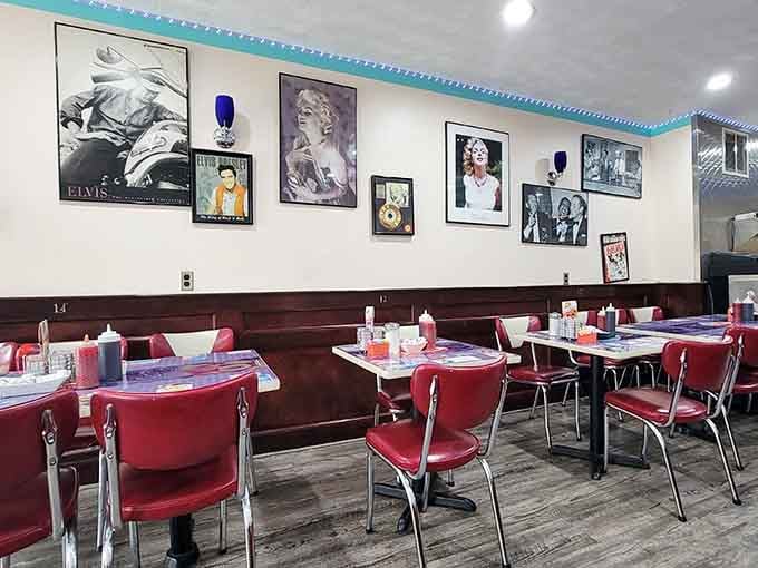 Elvis and Marilyn watching over red vinyl seating, where every meal comes with a side of nostalgia.