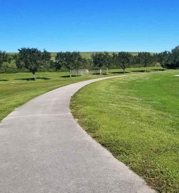 Winding pathways invite leisurely strolls past manicured lawns, where every curve reveals another reason to slow down and breathe.