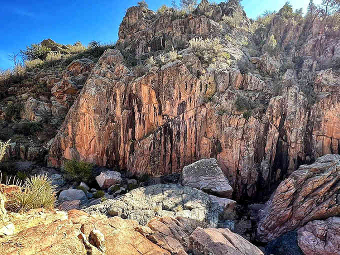 Towering cliffs frame the canyon in rust and amber, geology's greatest hits album carved over millions of years.