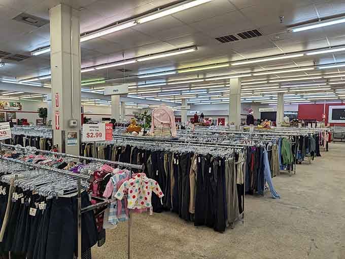 Clothing racks stretching into the distance, organized by size and type, making shopping here surprisingly stress-free and enjoyable.