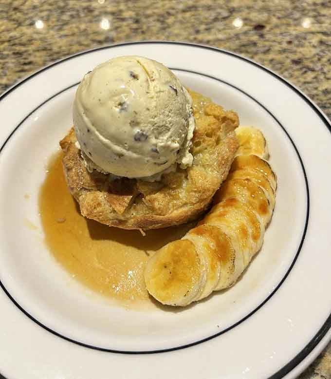 Banana bread pudding topped with ice cream, the kind of dessert that makes you forget about counting calories entirely.