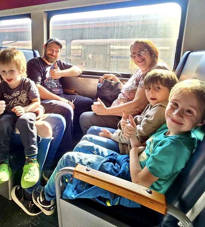 Happy faces all around because train rides have a magical way of turning strangers into friends instantly.