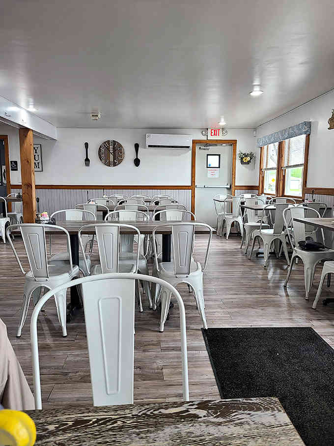 White metal chairs and rustic wood create that modern farmhouse vibe everyone's trying to achieve at home.