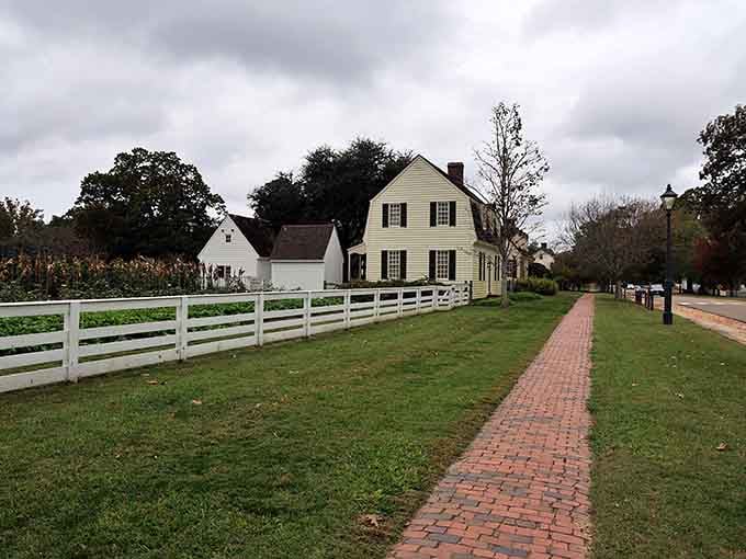 White picket fences and brick walkways stretching toward colonial homes, basically the American Dream in physical form since 1699.