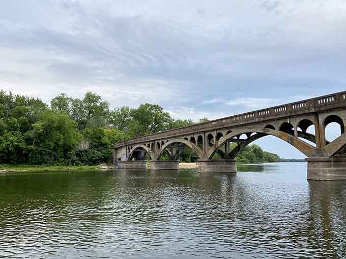 Bridges connecting Wisconsin and Minnesota, spanning water and state lines with graceful concrete arches.