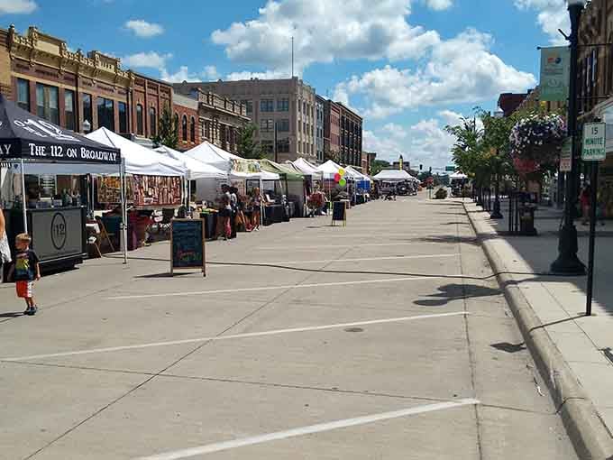 Albert Lea's farmers market buzzes with energy as vendors and neighbors gather under a sky that promises a perfect summer day.
