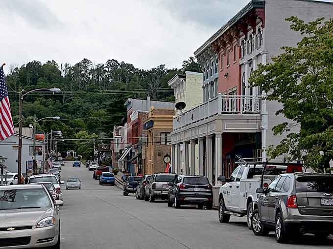 Hills embrace this main street like a protective hug, creating a cozy valley where community still means something.