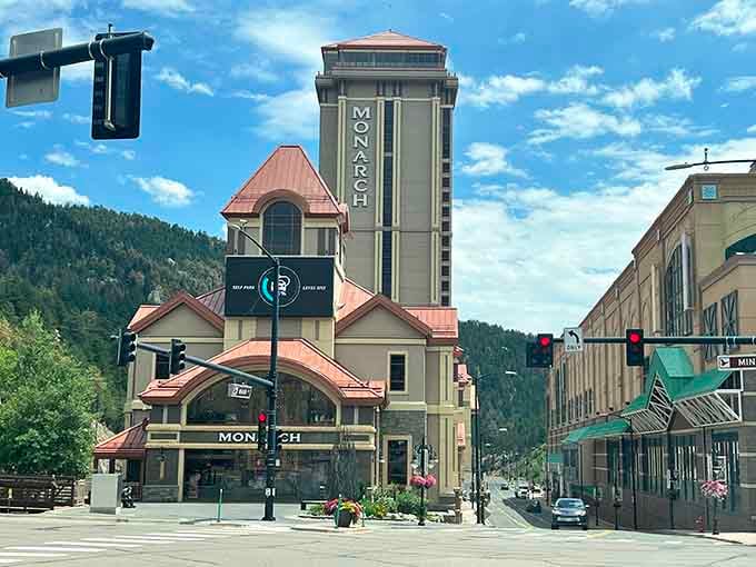 The Monarch Casino's distinctive tower rises above the street, blending mountain charm with a touch of Vegas.