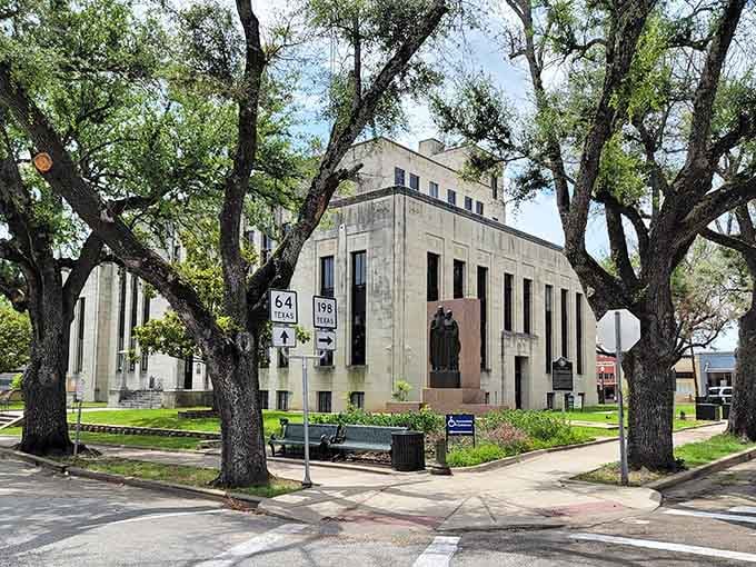 The courthouse stands like a Art Deco monument to civic pride, surrounded by ancient oaks that have witnessed generations pass.