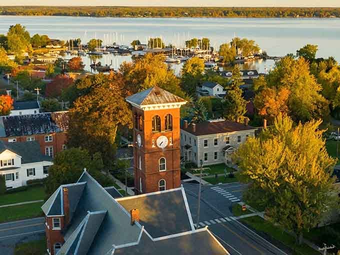 That brick clock tower rising above autumn's palette proves small-town America still knows how to make an entrance.