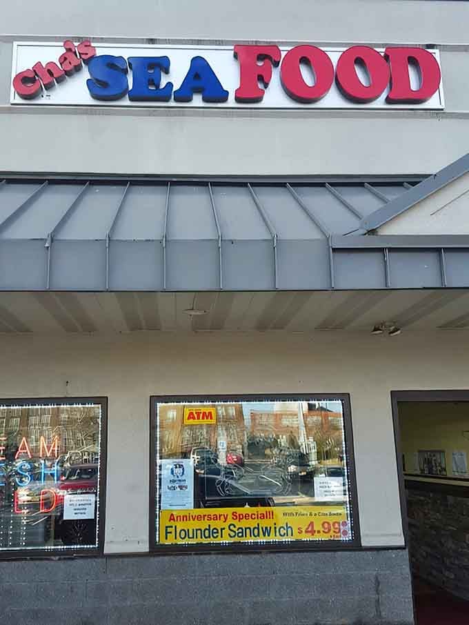 Bold red and blue lettering announces serious seafood in a straightforward setting where quality trumps fancy decorations every time.