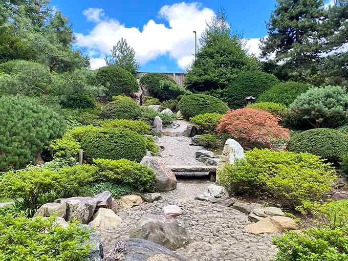 Stone pathways meander through the Japanese Garden, where every carefully placed rock serves a meditative purpose beyond decoration.