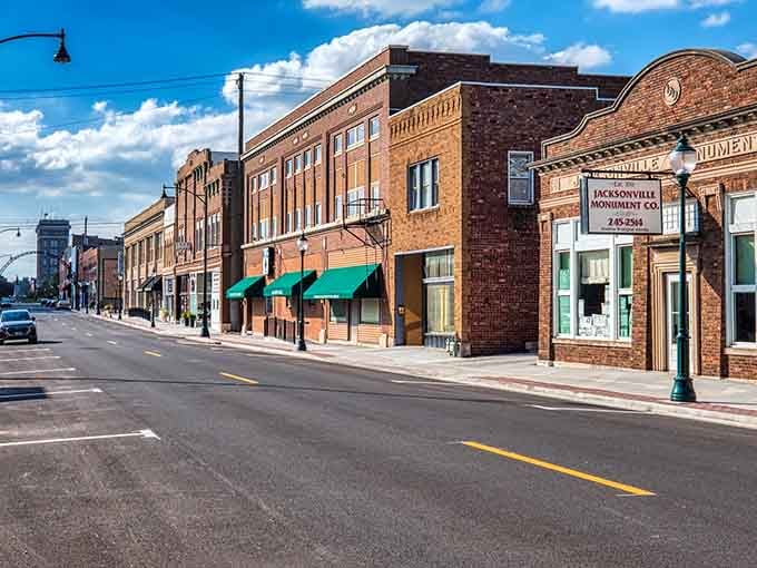 Green awnings and classic brick create a rhythm along the street that feels like visual comfort food for the soul.