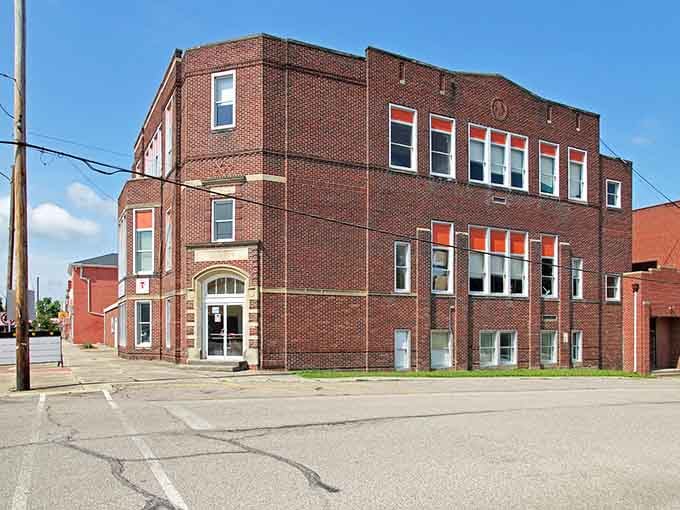 A sturdy brick building stands as testament to communities that built things to last, not just until the next development boom arrived.