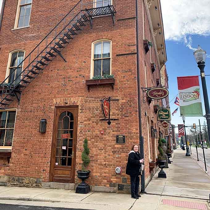 Historic brick buildings with fire escapes zigzagging up their sides tell stories of commerce and community through the decades.