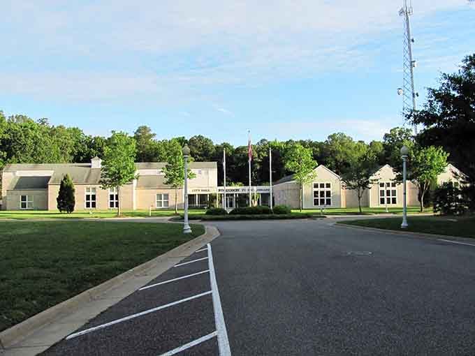 Lush green lawns surround this community center where modern design meets traditional values in perfect harmony together.