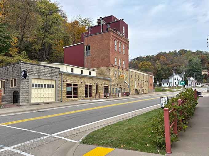 That historic brewery building stands proud against autumn hillsides, a testament to communities that honor their past while embracing today.