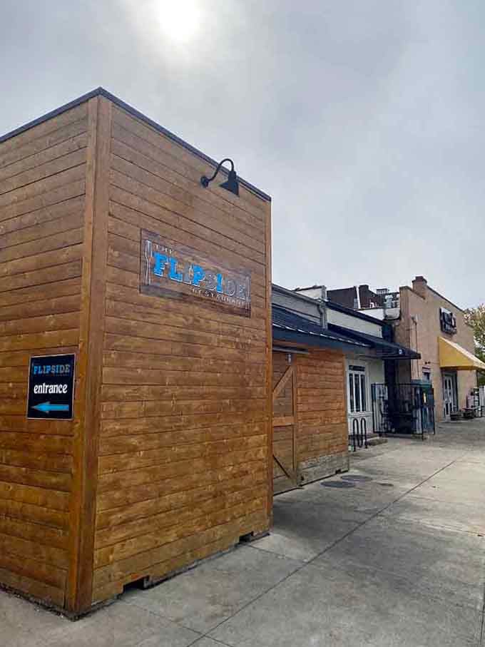 That rustic wooden entrance structure adds modern coastal flair while keeping things refreshingly casual and unpretentious for everyone.