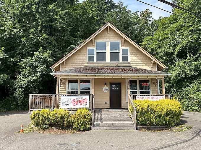This charming cottage-style building looks like someone's grandmother's house, except grandma never made burgers quite this enormous or satisfying.