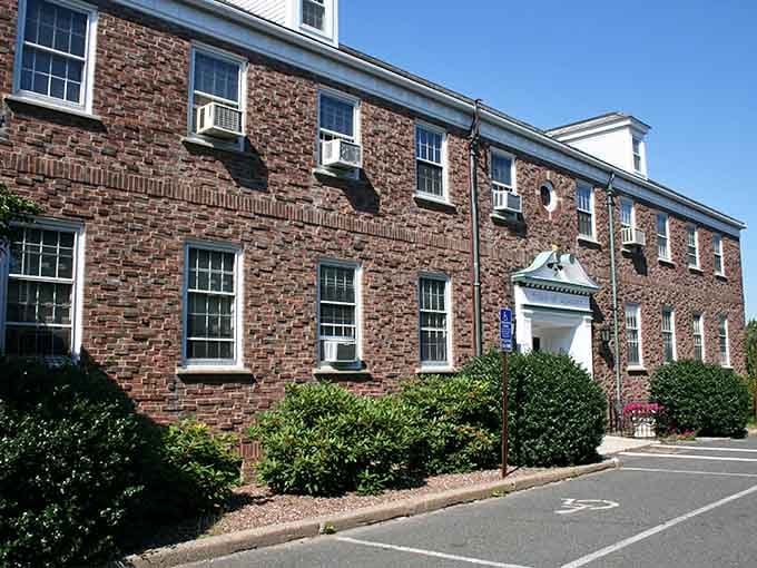 Brick buildings with white trim stand proudly, representing the kind of solid, dependable community we all secretly crave.