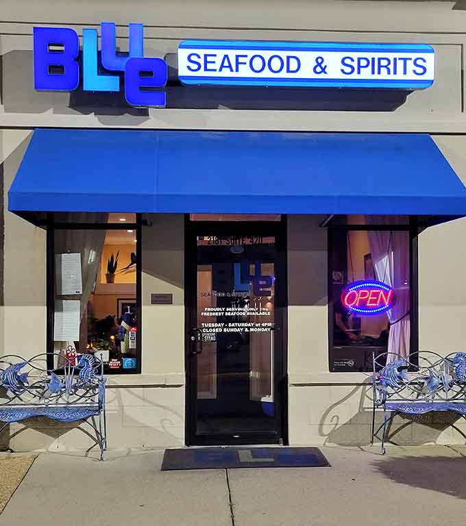 That glowing neon "OPEN" sign beckons like a lighthouse, guiding seafood lovers to their next delicious coastal adventure.