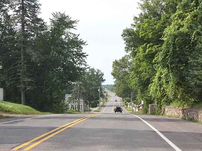 The open road stretches endlessly through forests, promising solitude and the kind of peace that money simply cannot buy.