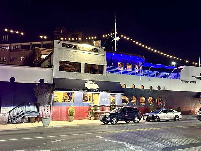 Twinkling lights transform the ship into an evening spectacle where dinner feels like embarking on a magical voyage.
