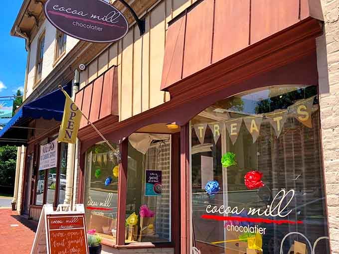 Colorful window decorations and welcoming signage make this chocolatier impossible to pass without stopping inside.