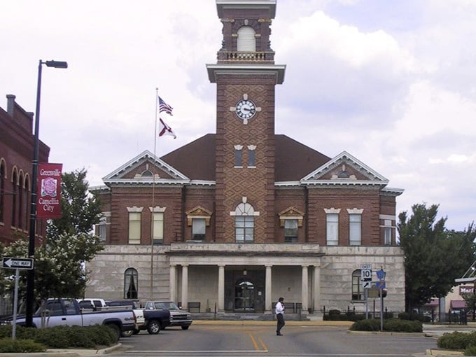 The stately courthouse clock tower dominates the town square, keeping time for generations of residents below.