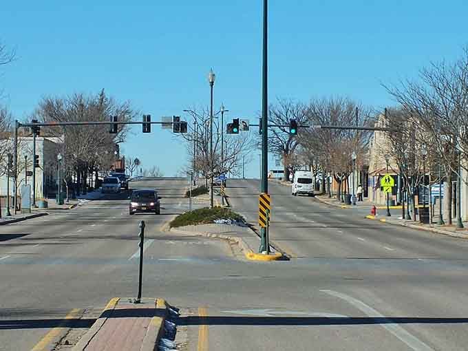 Tree-lined medians soften the wide boulevard, showing how prairie towns balance their agricultural roots with touches of urban planning grace.