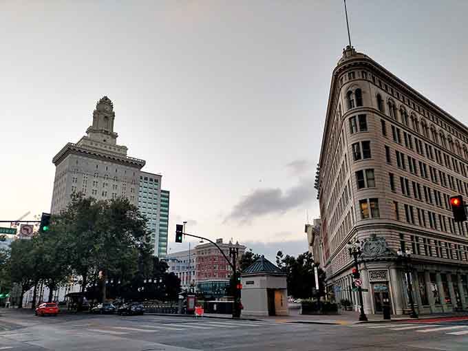Historic buildings frame downtown Oakland's intersection where time seems to move at a gentler pace.