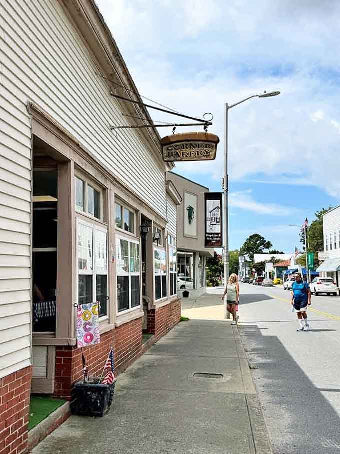 The "Corner Bakery" sign beckons like a lighthouse &ndash; guiding hungry travelers to homemade goodness and community warmth.