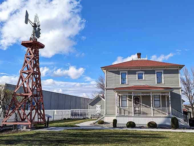 That vintage windmill and historic home celebrate agricultural heritage in a place where roots still matter deeply.