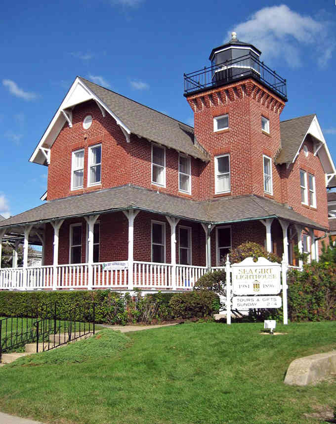 Red brick lighthouse architecture commands attention with Victorian charm, standing as a proud guardian of coastal heritage and history.
