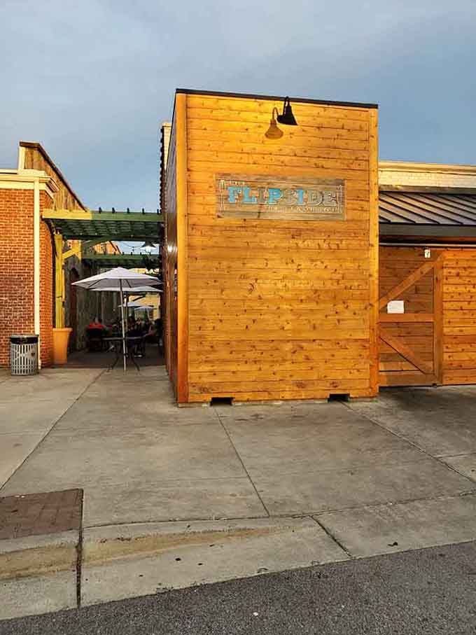 Golden hour sunlight bathes the natural wood exterior, promising warm hospitality and satisfying comfort food waiting inside.