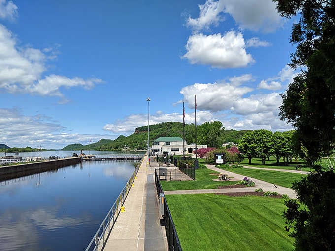 The Mississippi River frames this waterfront park where manicured lawns meet ancient bluffs in perfect Midwestern harmony and beauty.