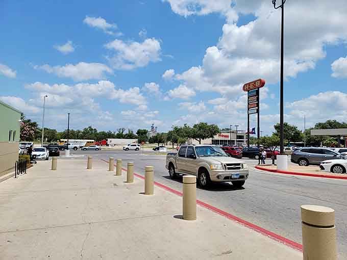 Wide Texas skies stretch endlessly above practical shopping centers where folks still wave at neighbors between errands and coffee runs.