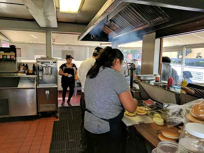 Behind the scenes, the kitchen crew works their magic turning beef into pure happiness daily.
