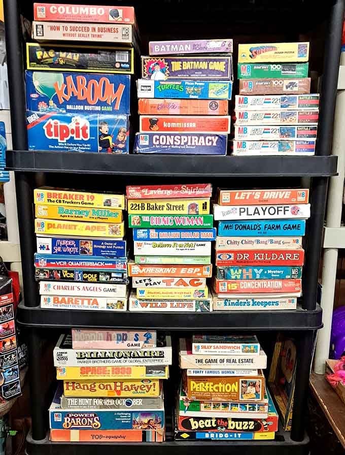 Board games from childhood stacked high, back when entertainment didn't require WiFi or batteries.