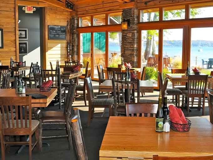 The dining room's rustic elegance and panoramic bay views create an atmosphere where every meal feels like a celebration.