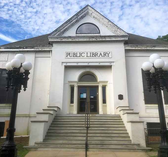 Classic Beaux-Arts design meets practical purpose at this public library where knowledge waits behind those elegant arched doors patiently.