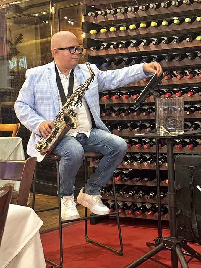 Live saxophone music transforms your meal into dinner theater, minus the awkward audience participation and overpriced tickets.