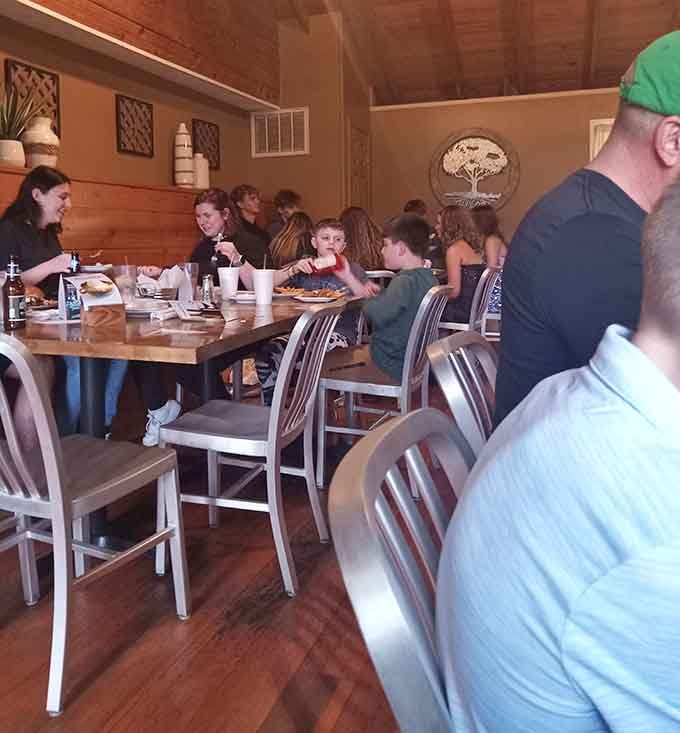 Families gathered around tables sharing meals together, exactly the kind of scene that makes restaurants feel like community hubs.