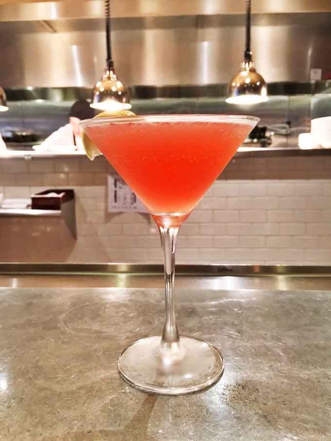 A coral-hued cocktail that looks like a Minnesota sunset decided to take liquid form for your enjoyment.