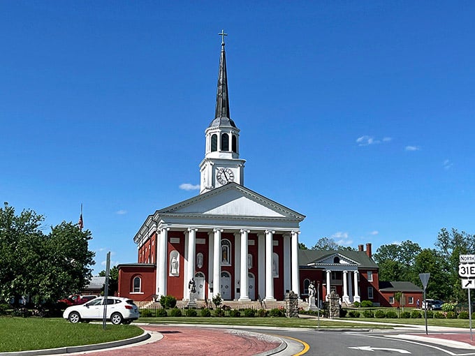 That soaring white steeple reaches skyward like it's trying to high-five the clouds on a gorgeous day.